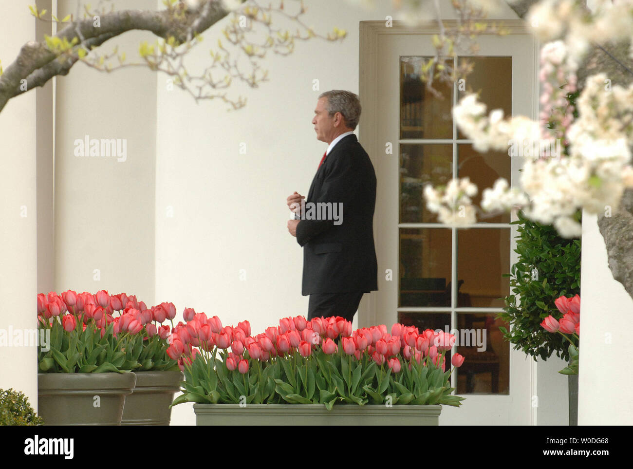 U.S. President George W. Bush leaves the Oval Office of the White House ...