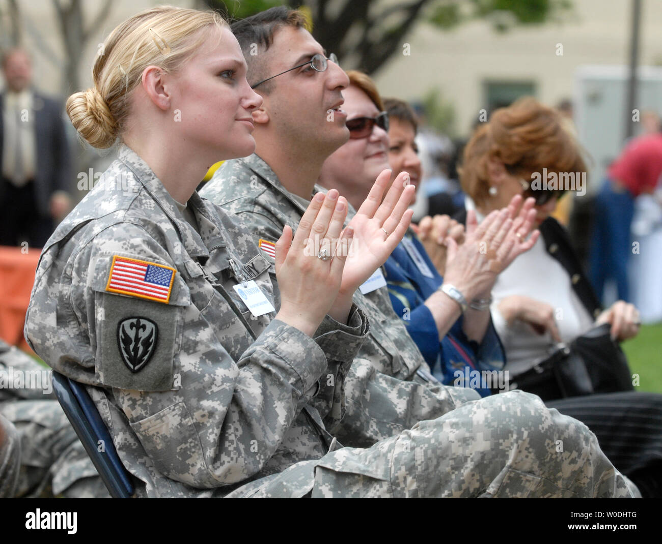 Members of the military watch as singer/song writer Jenny Boyle ...