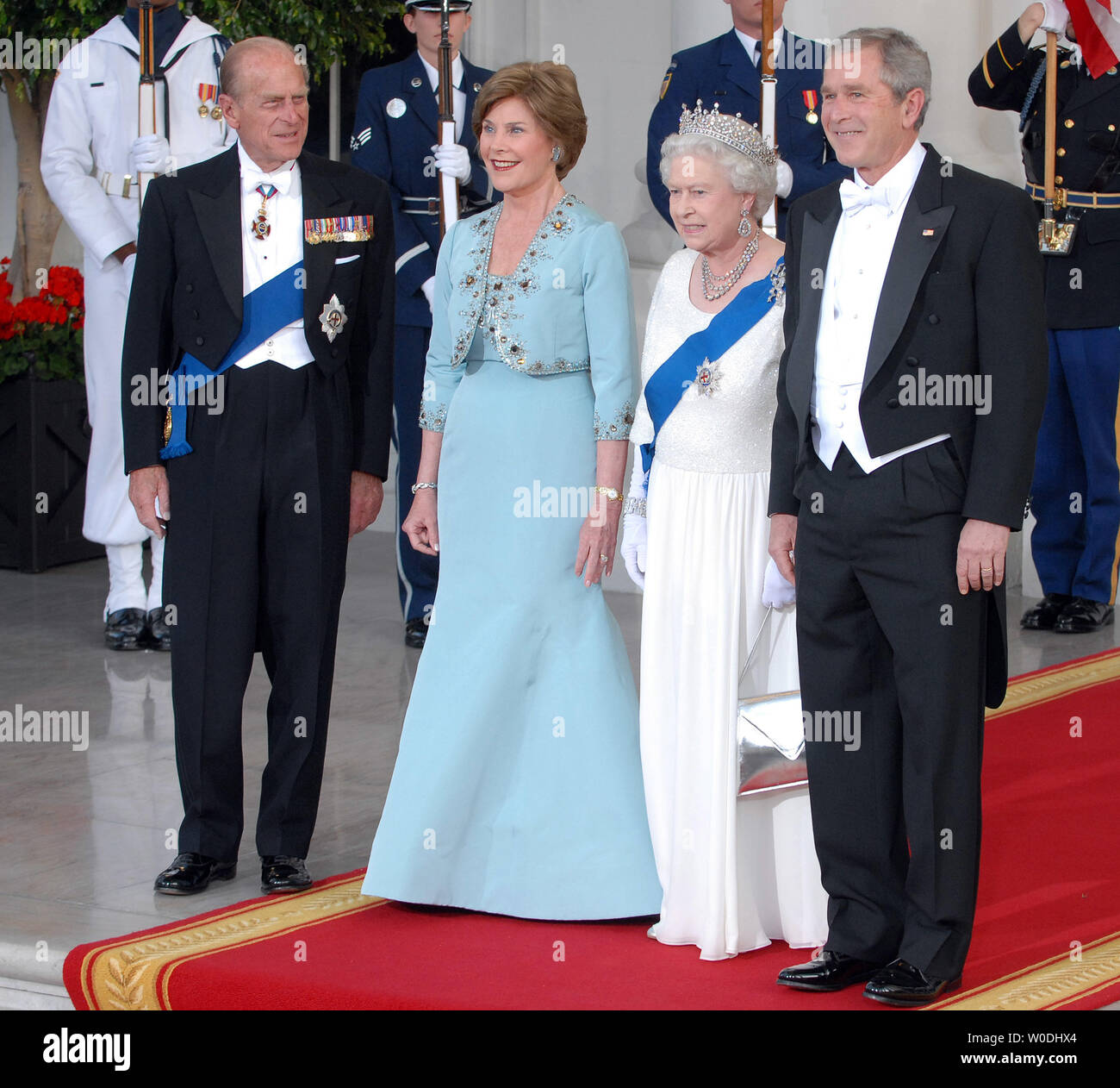 Britain's Queen Elizabeth II and her husband Prince Philip are greeted ...