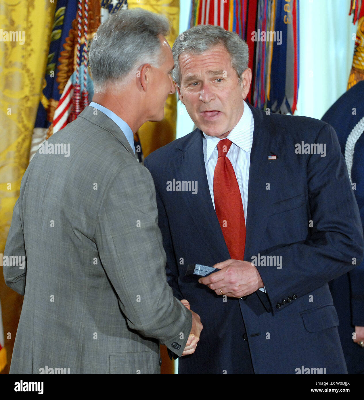 U.S. President George W. Bush greets Michael Winton as he receives a ...