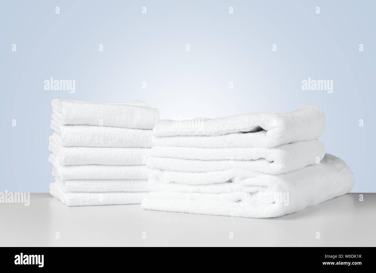 Stack of folded white spa towels Stock Photo - Alamy