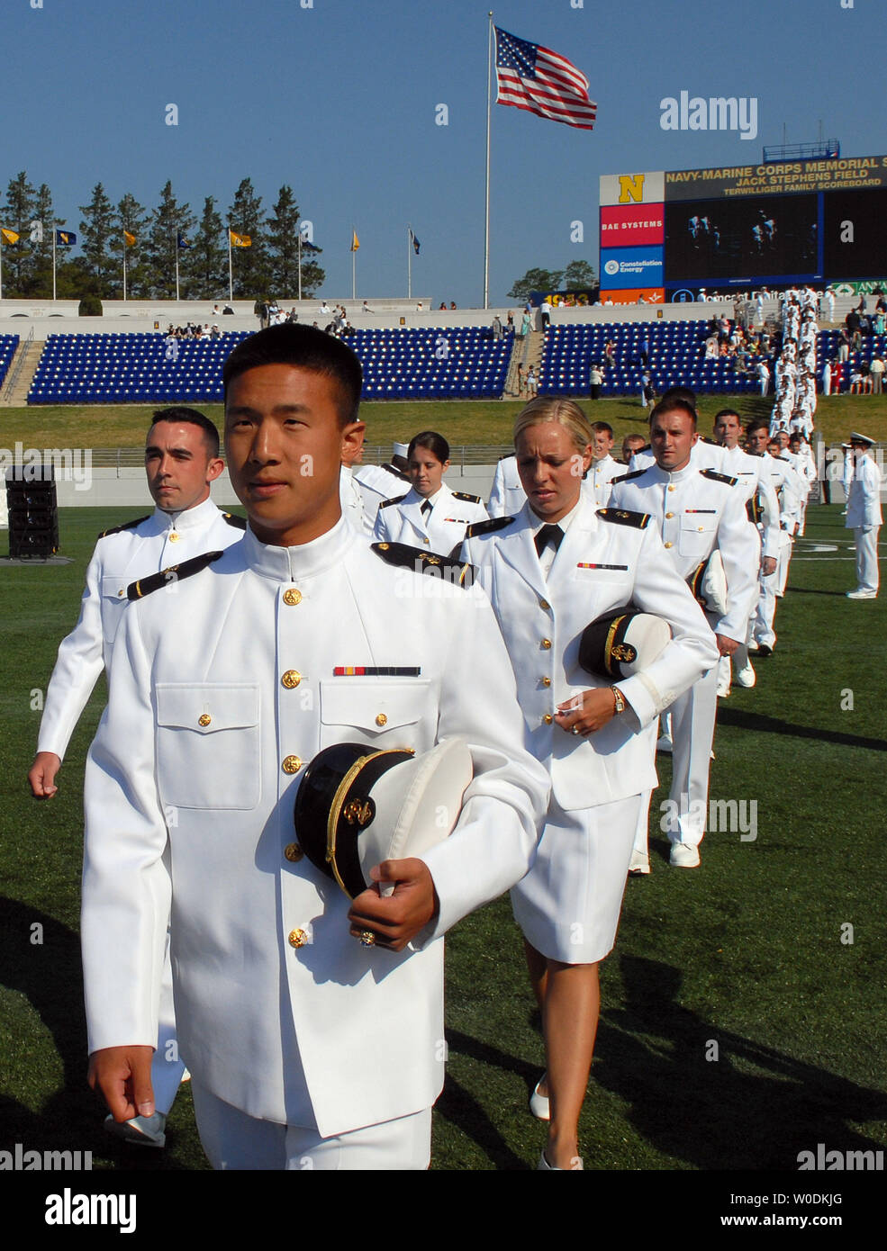 Members of the graduating class process into Navy-Marine Corps stadium ...