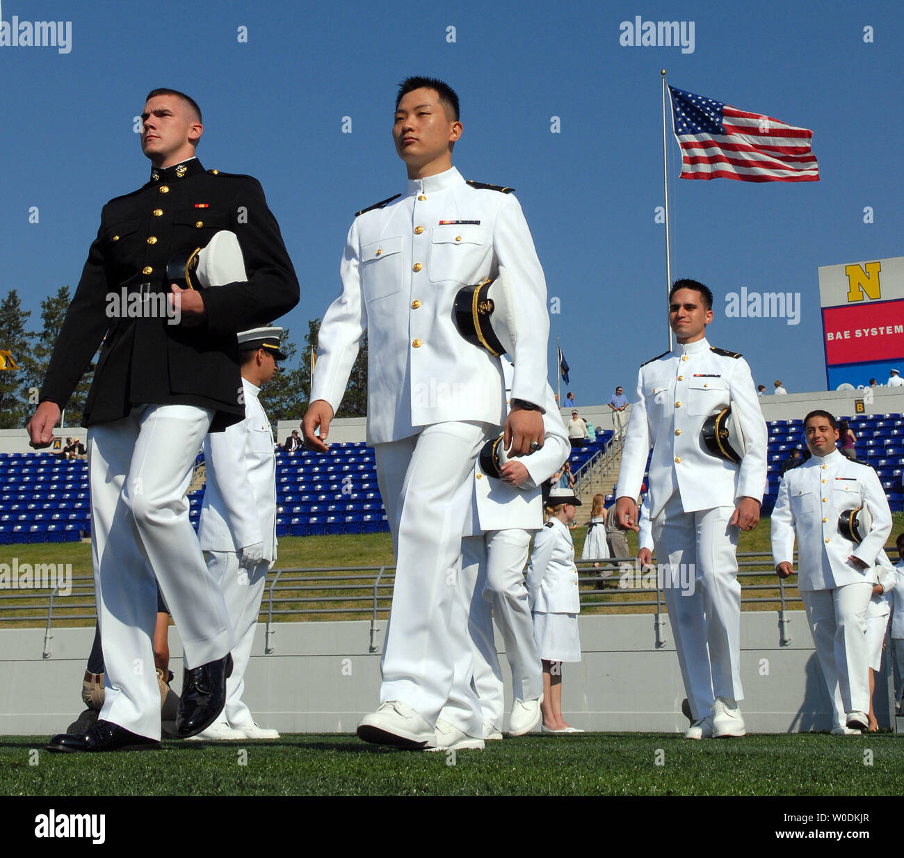 Members of the graduating class process into Navy-Marine Corps stadium ...