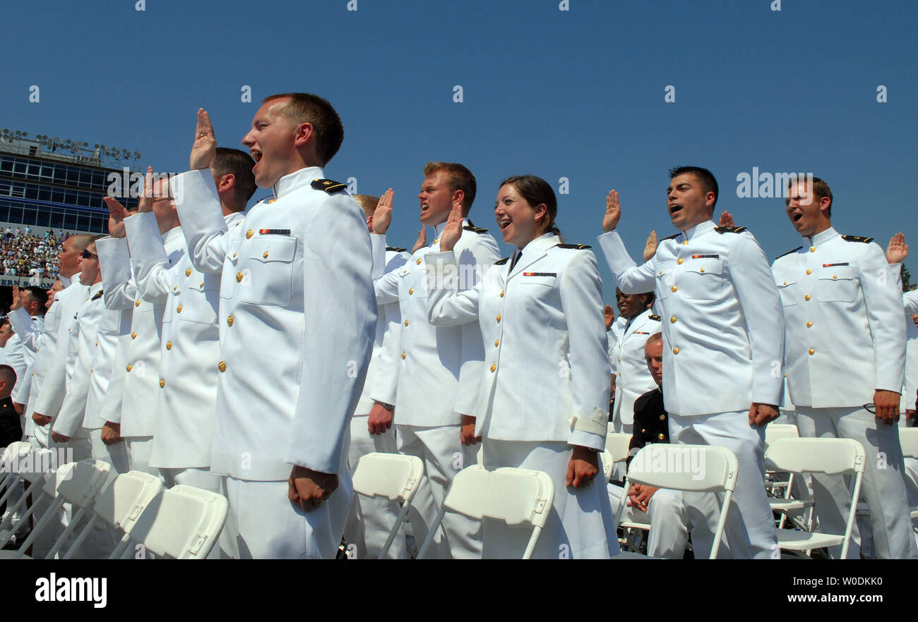 Graduating members of the United States Naval Academy take the oath of ...