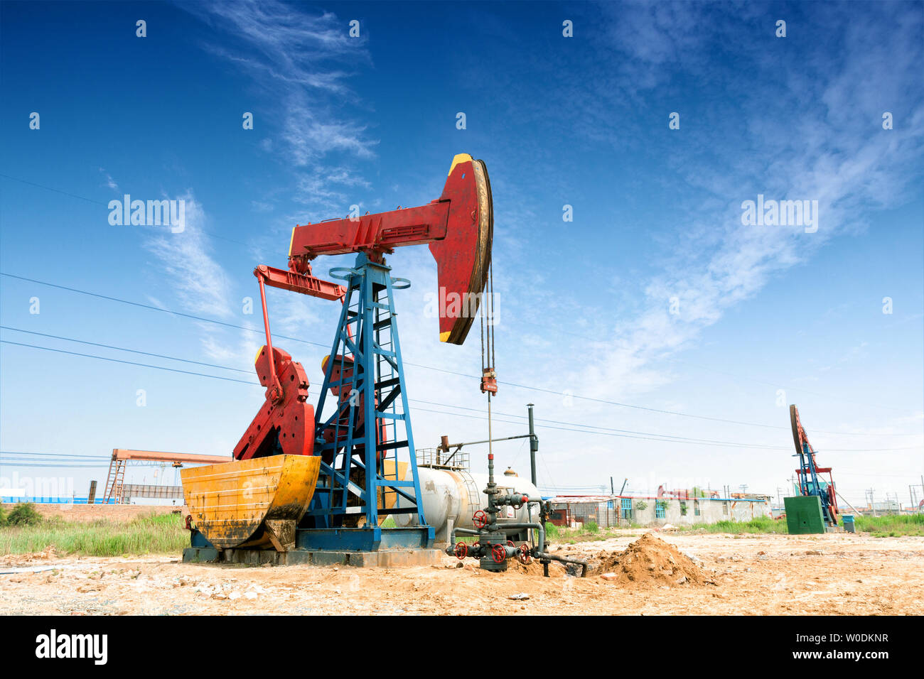 Oil well and bluesky Stock Photo - Alamy