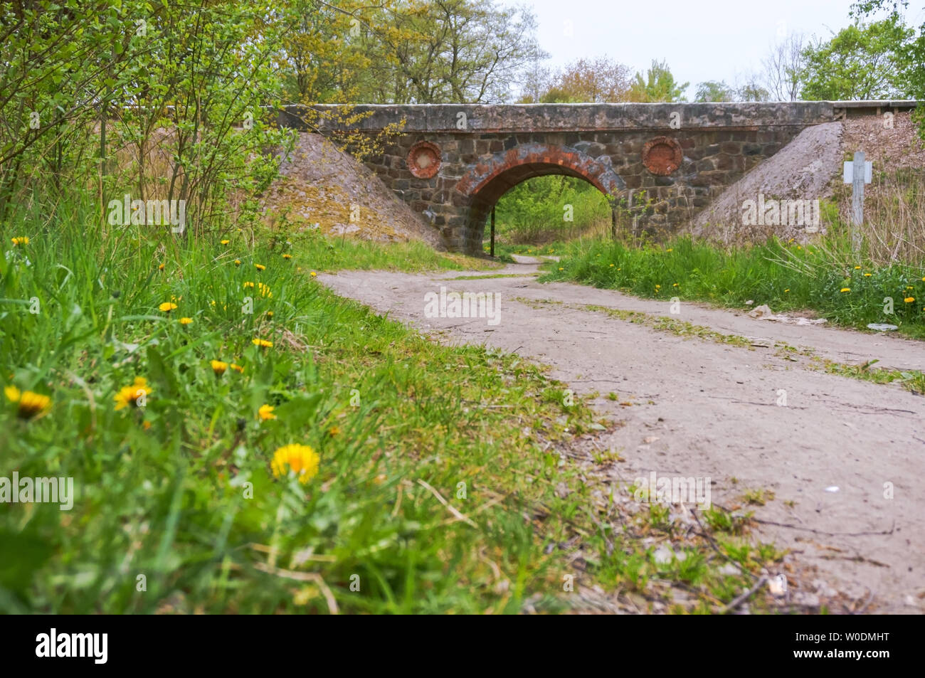 old stone viaduct, an arched railway bridge over the road Stock Photo ...