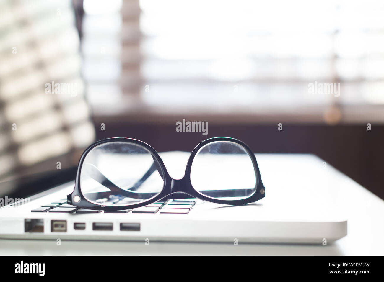 Comfortable work table in office Stock Photo - Alamy