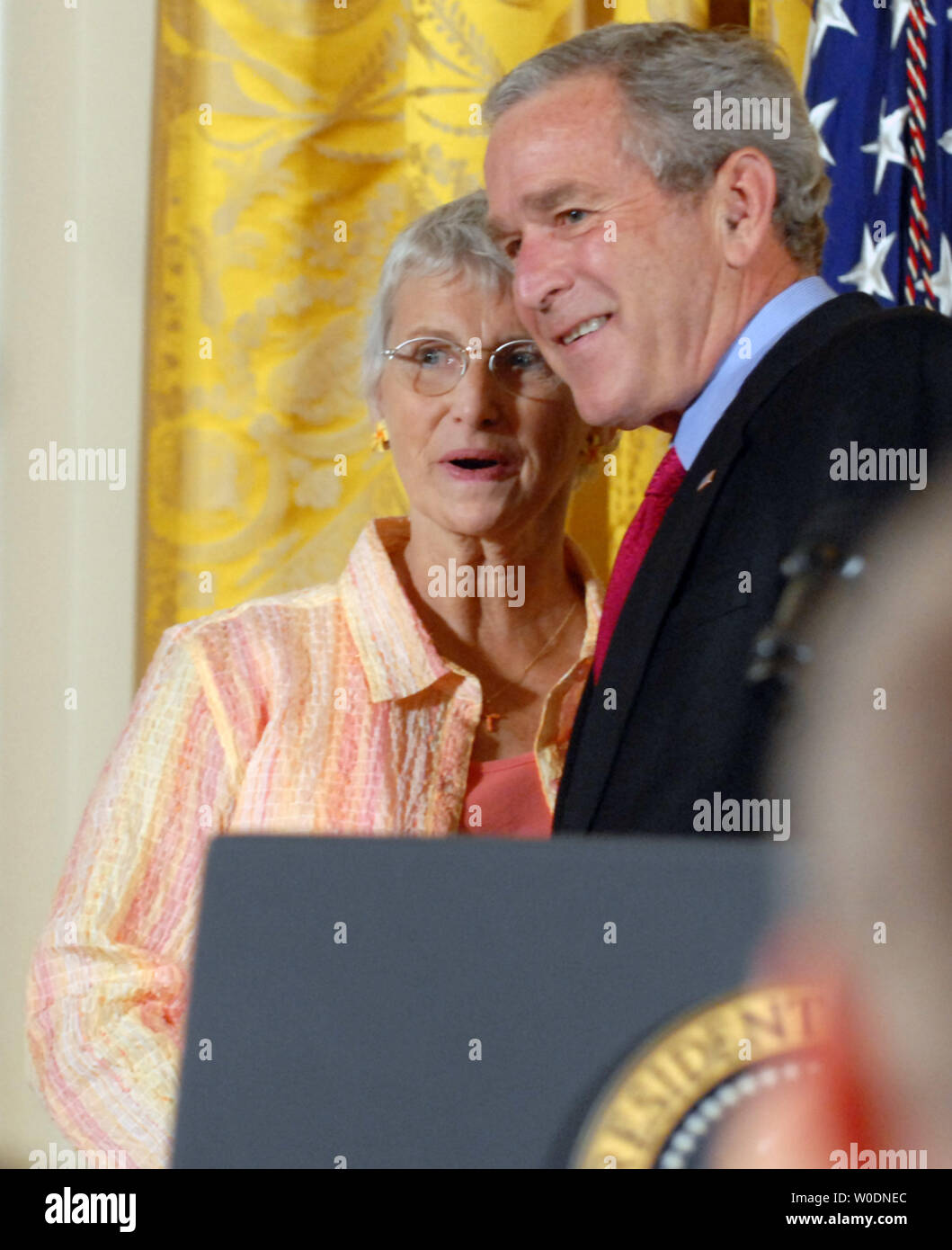 U.S. President George W. Bush greets Carol Franz after speaking about ...