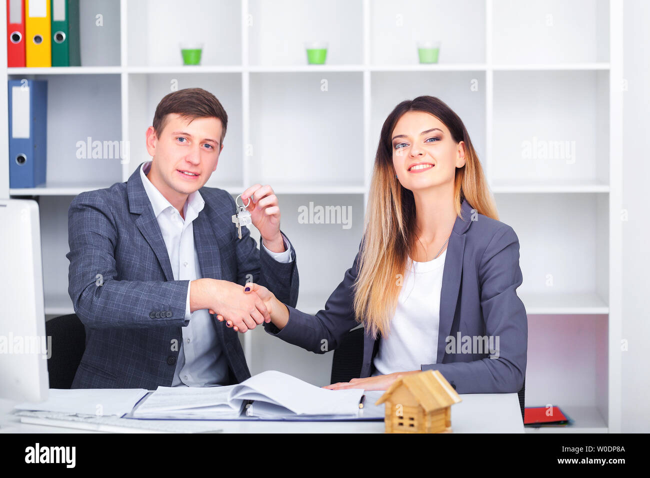 Sales manager giving advice to his couple clients Stock Photo - Alamy