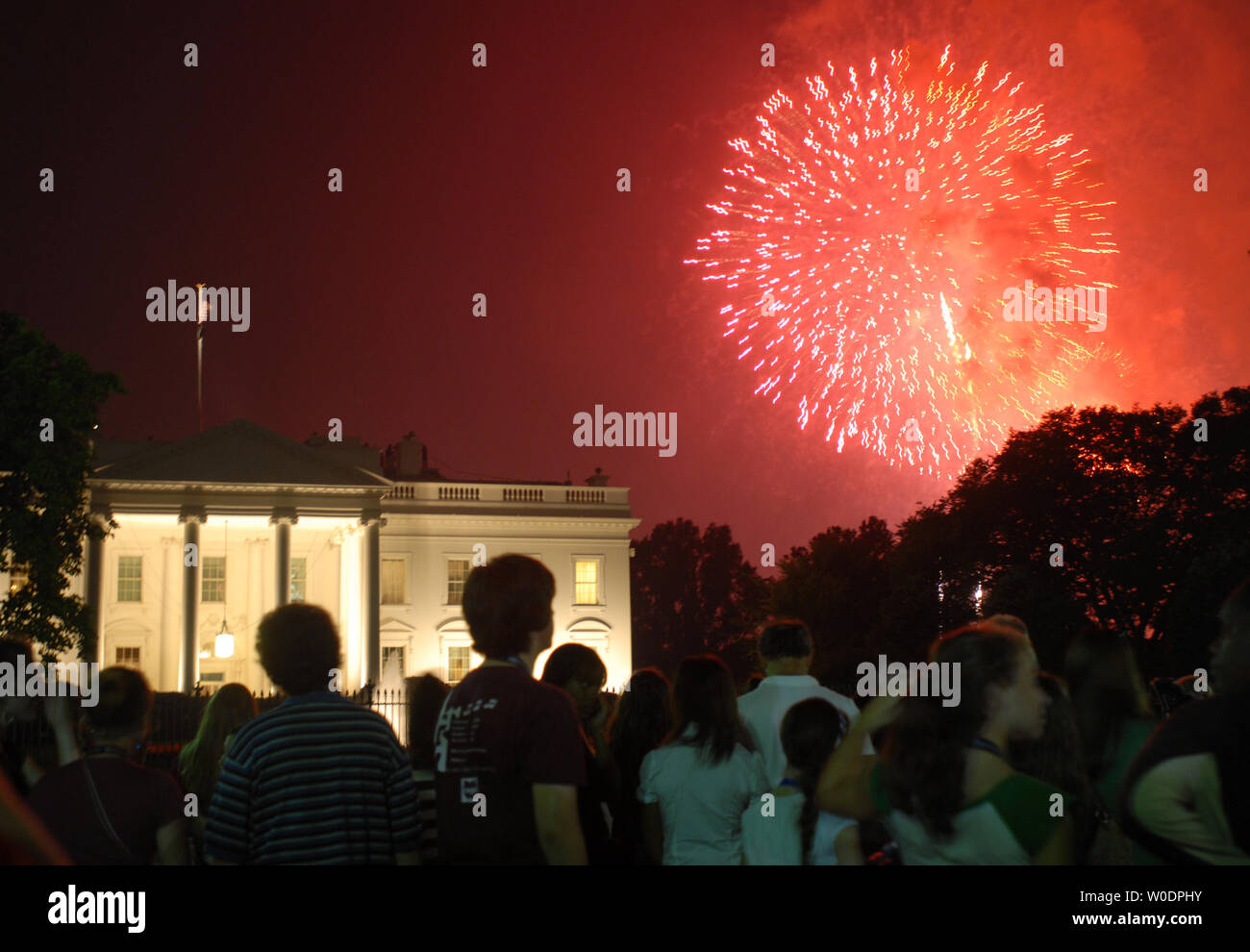 Fireworks burst over the National Mall as people gather to watch ...