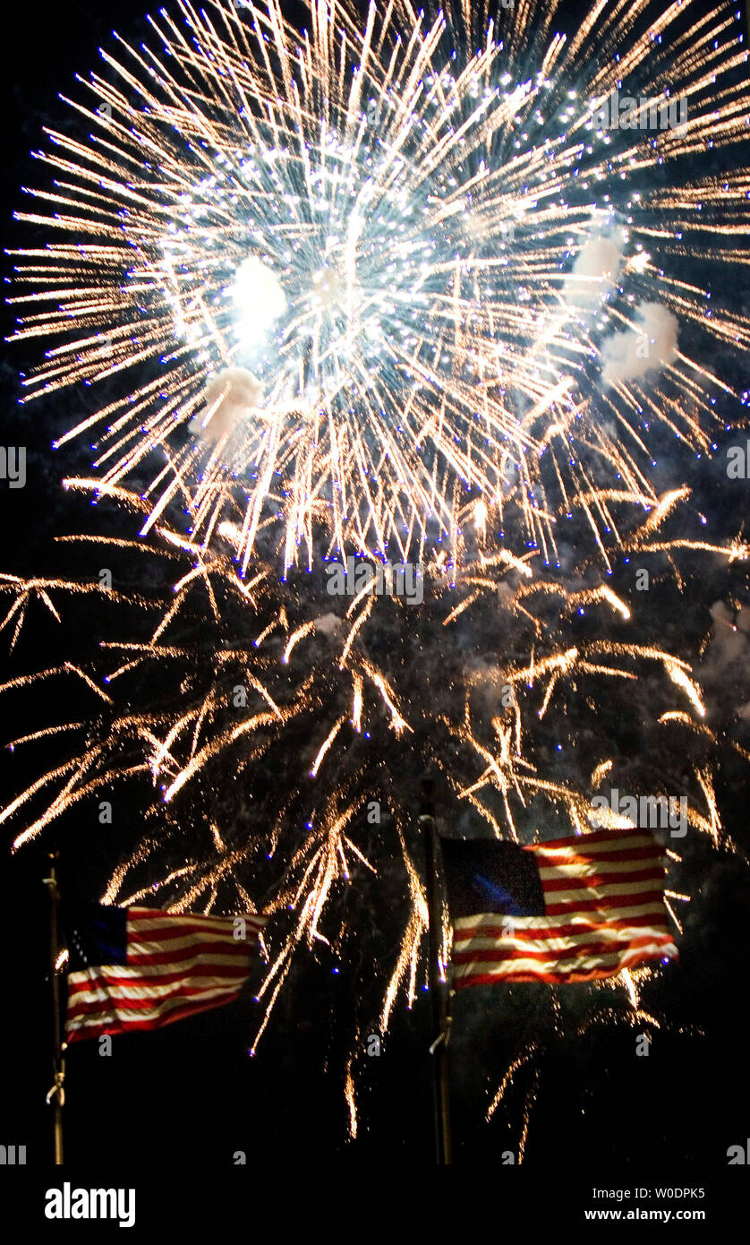 Flags wave in the wind near the Washington Monument during the ...