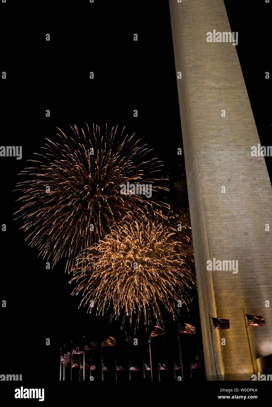 Flags wave in the wind near the Washington Monument during the ...