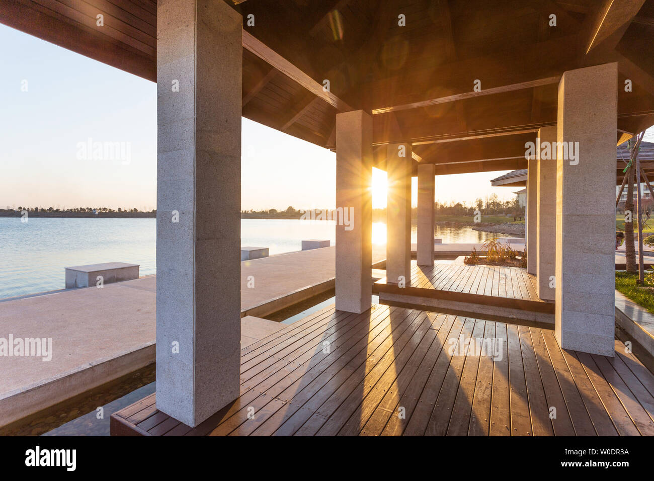 resort lakeside pavilion at sunset Stock Photo - Alamy