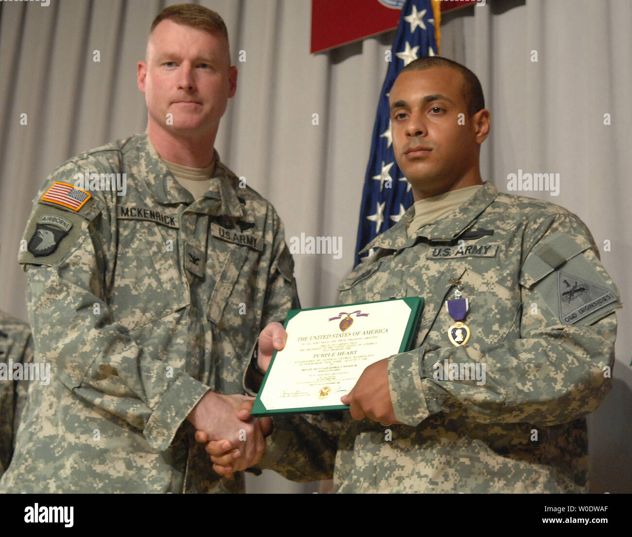 Army SPC George Wilson (R) poses for a photo with Corporal Terrence ...