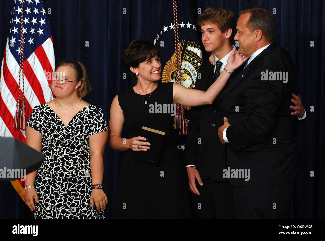 Jim Nussle is joined by his family after Nussle was sworn into office ...