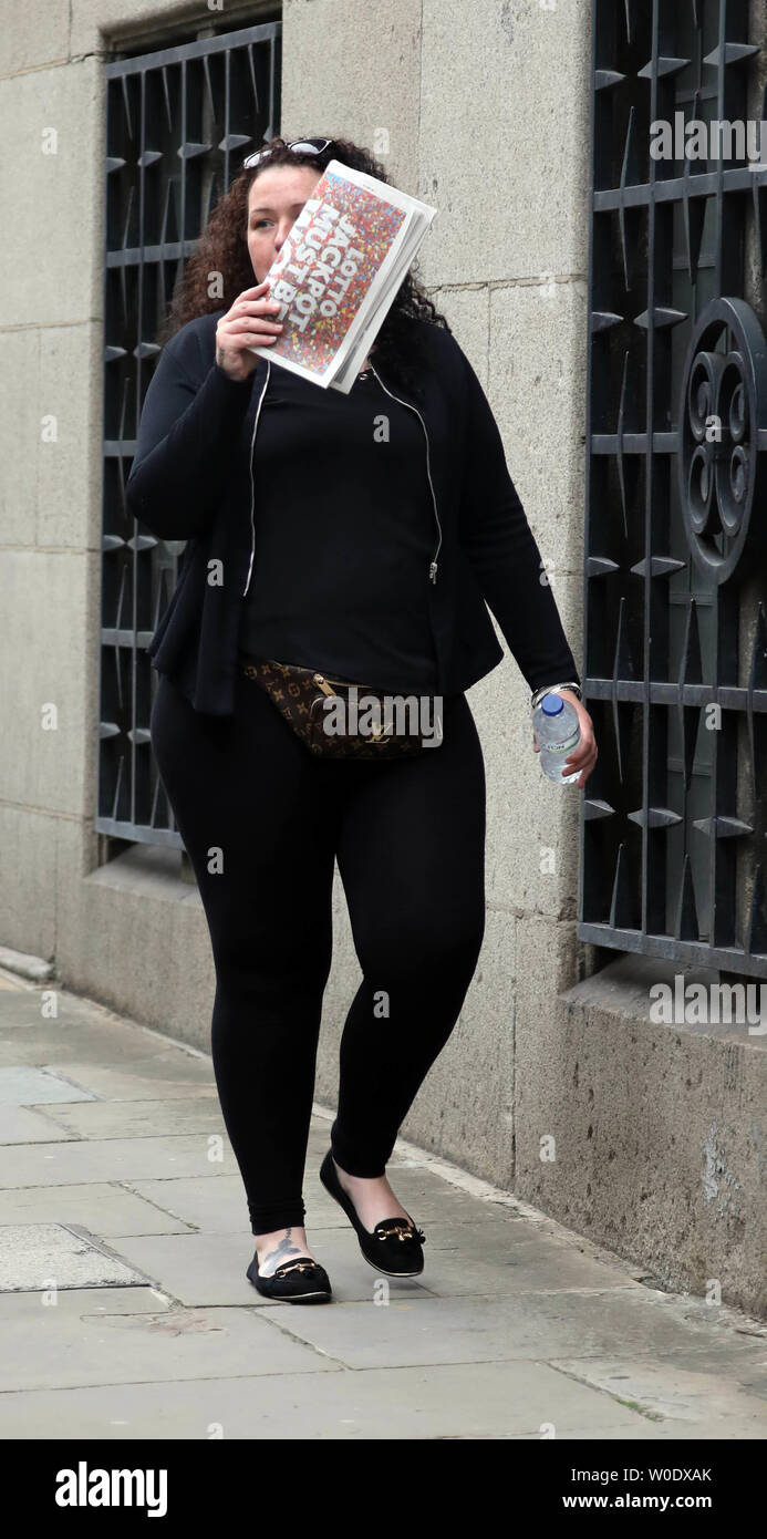 Pic shows: Chelsea Mitchell arrives at the Old Bailey hiding her face ...