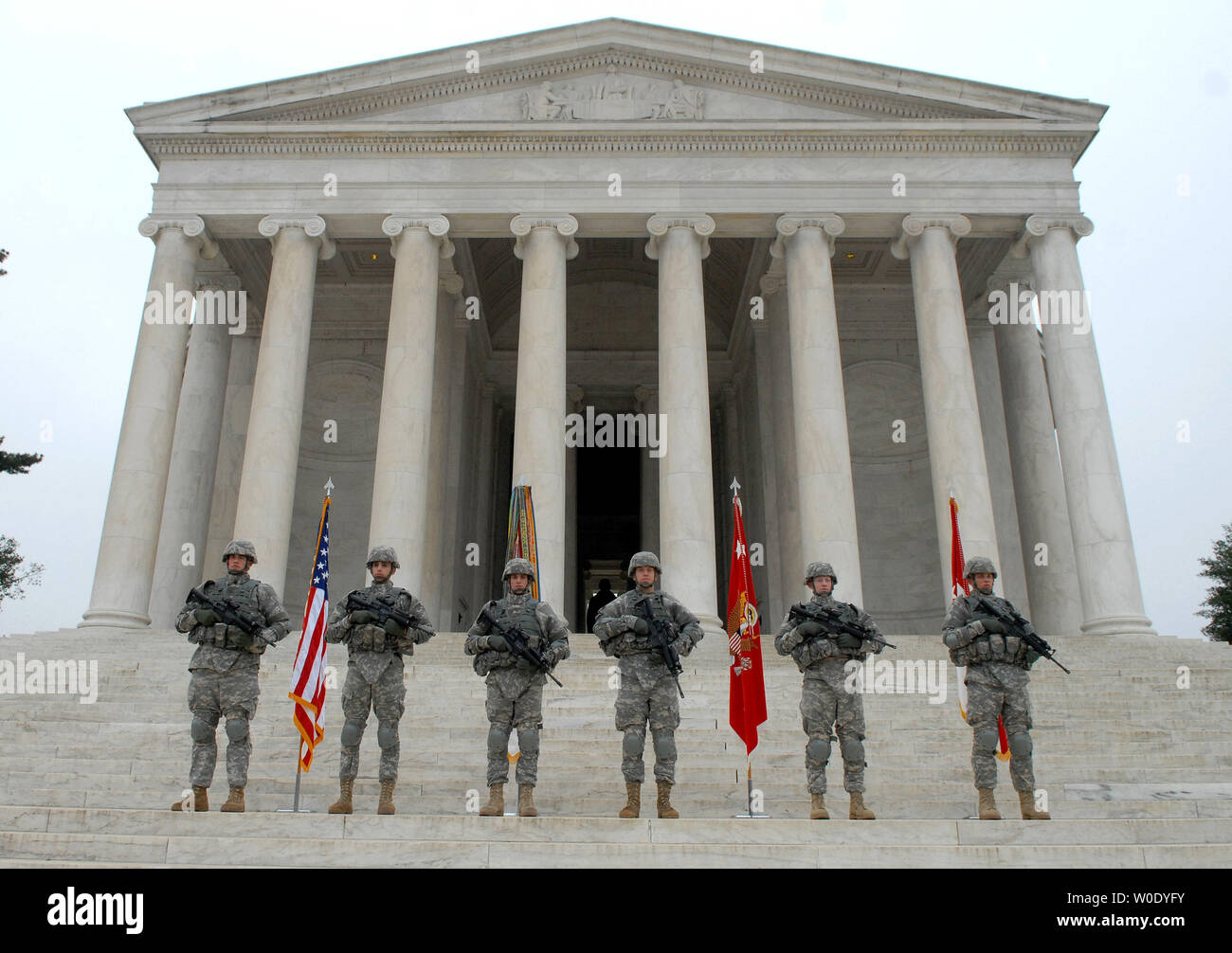 Members of the Army's Old Guard stand in formation during a swearing-in ...