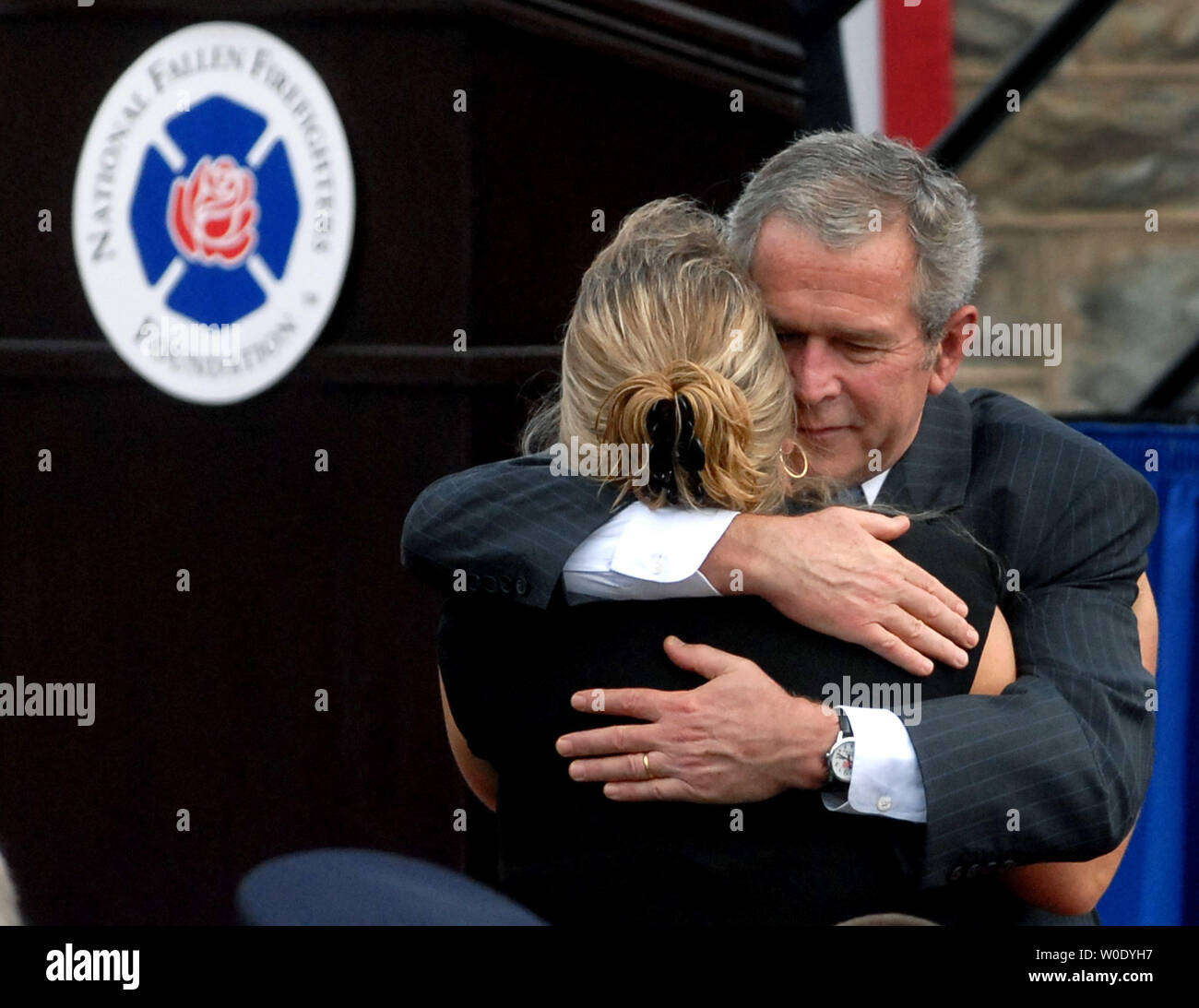 U.S. President George W. Bush greets family members of a firefighter ...