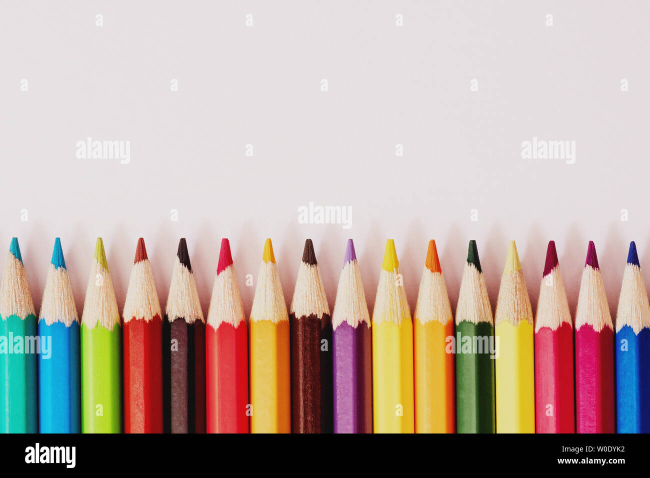 row of crayons on a white background Stock Photo - Alamy