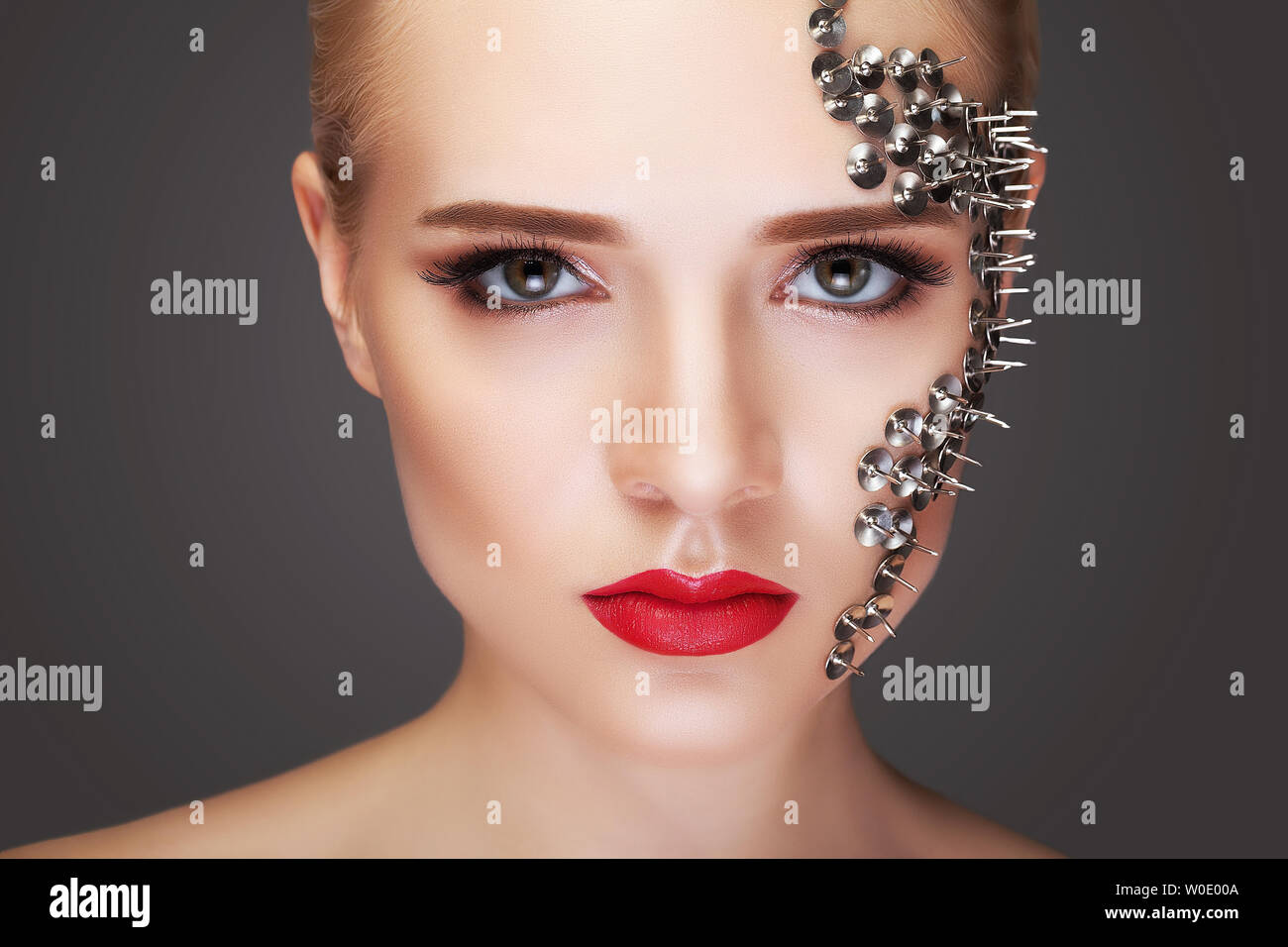 Fashion portrait of a beautiful woman with long eyelashes and piercing ...