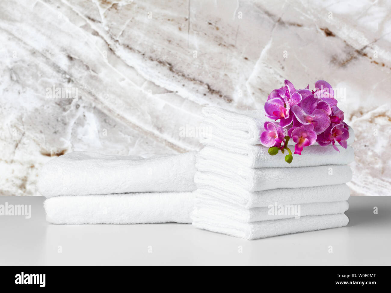 Stack of folded white spa towels Stock Photo - Alamy