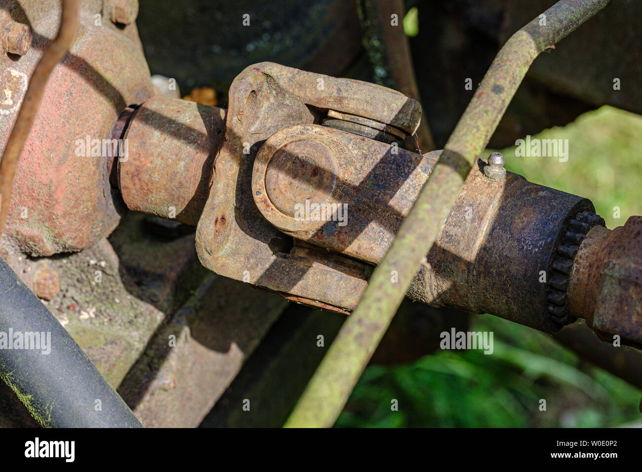 vintage retro tractor rusty details close up. gearbox, levers, viring ...