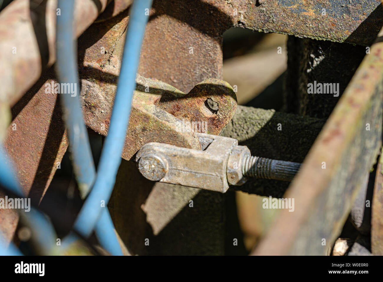vintage retro tractor rusty details close up. gearbox, levers, viring ...
