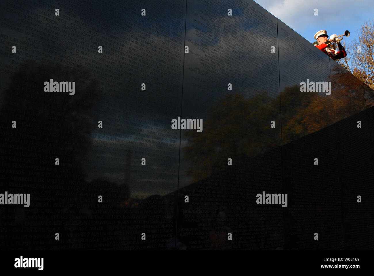 Marine bugler Staff Sgt. Michael Warnick performs Taps prior to the ...