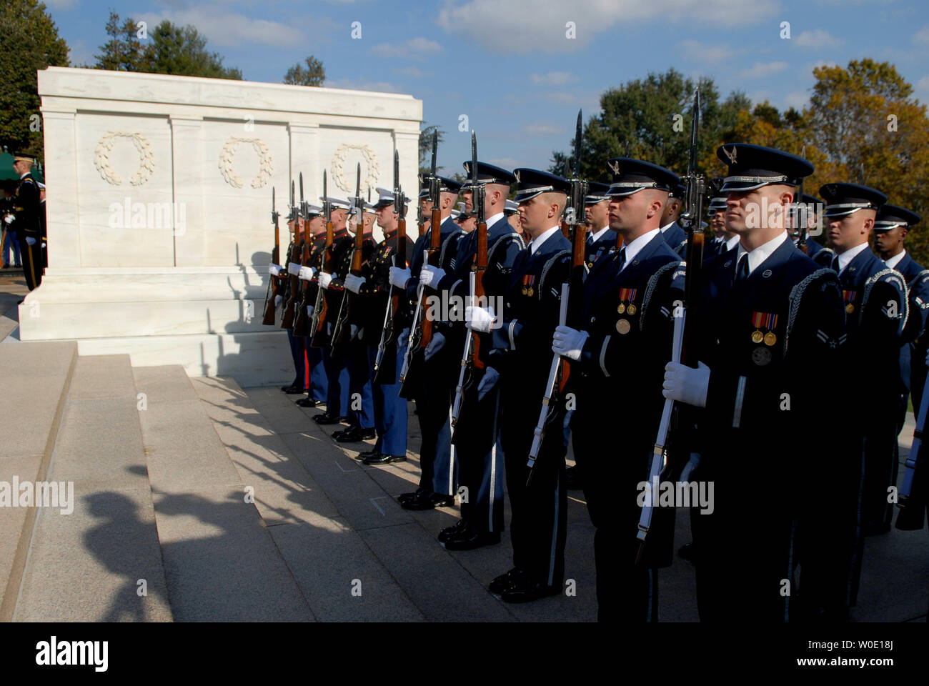 Members of the Marine and Air Force Honor Guard participate in a ...