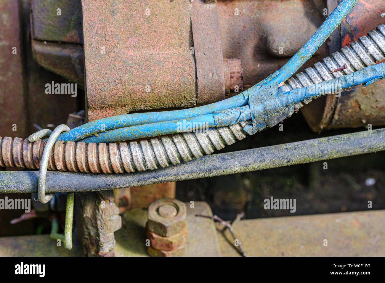vintage retro tractor rusty details close up. gearbox, levers, viring ...