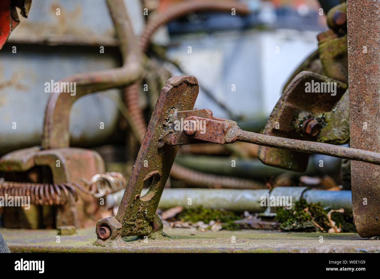 vintage retro tractor rusty details close up. gearbox, levers, viring ...