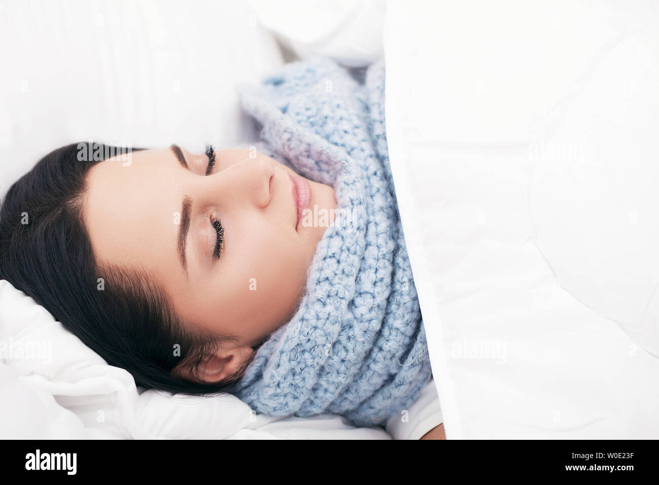 Beautiful woman lying and sleep on the snowy bed Stock Photo - Alamy