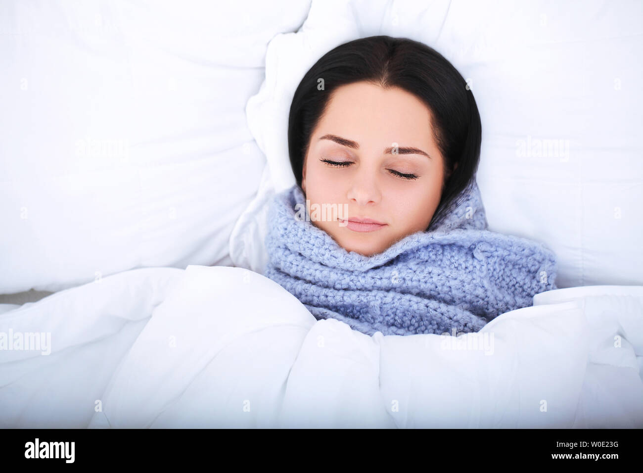 Beautiful woman lying and sleep on the snowy bed Stock Photo - Alamy