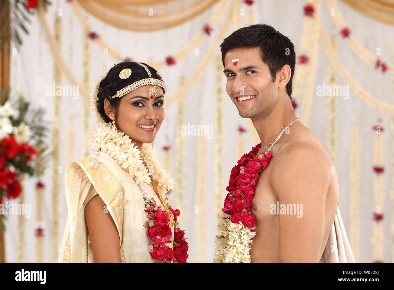 Couple after performing Mala Badal ceremony in wedding mandap Stock ...
