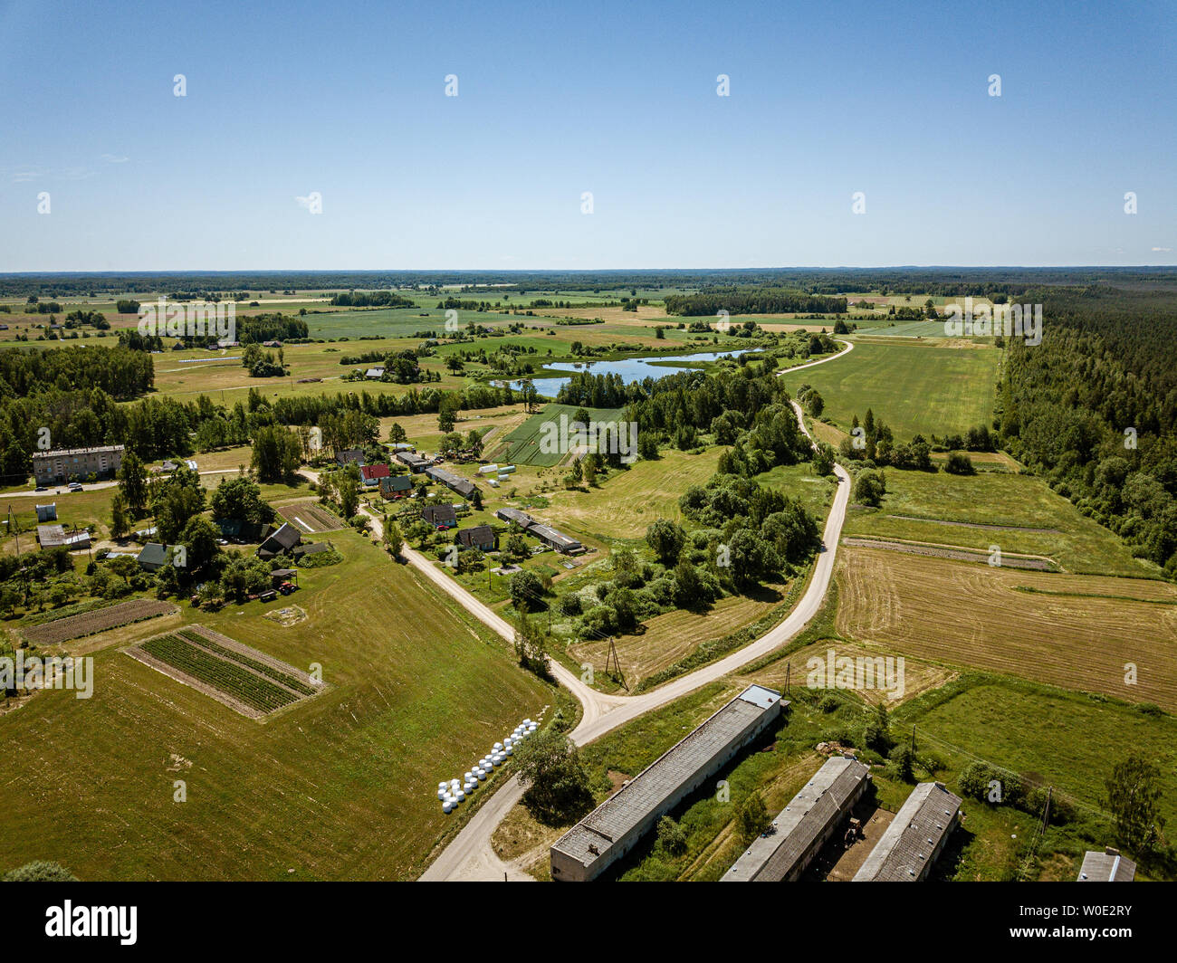 countryside roads and fields with small village. aerial view, drone ...