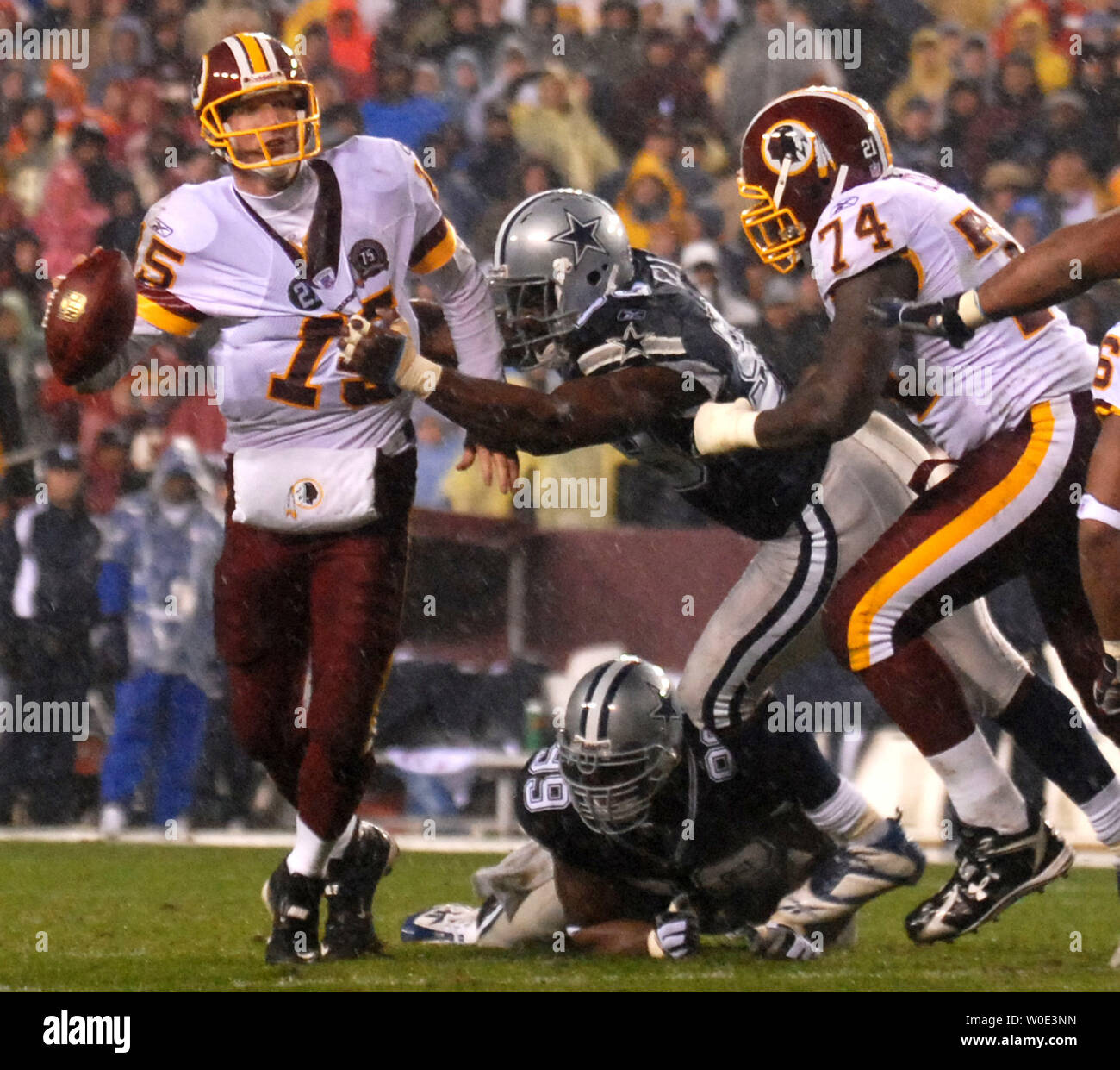 Washington Redskins quarterback Todd Collins passes under pressure ...