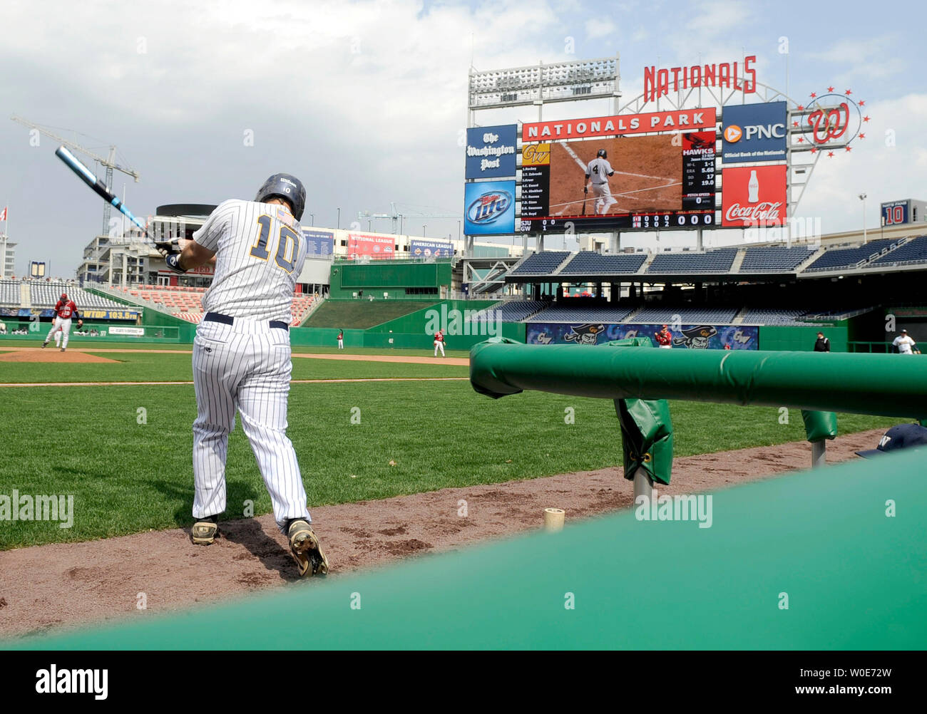 George Washington University junior Gavin Swanson warms up prior to ...