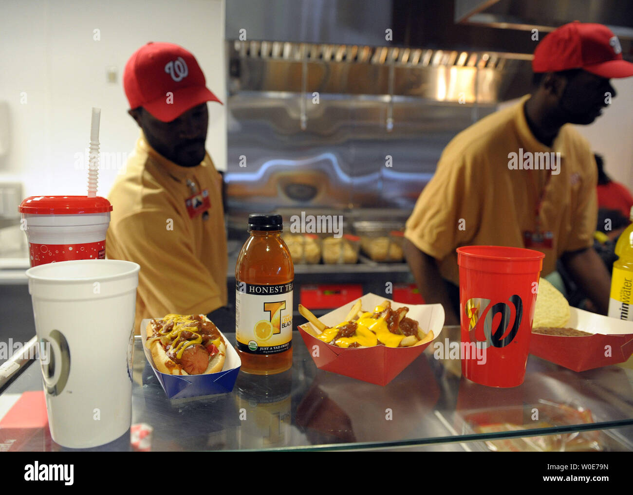 Concession stand workers serve up food as The Washington Nationals hold ...