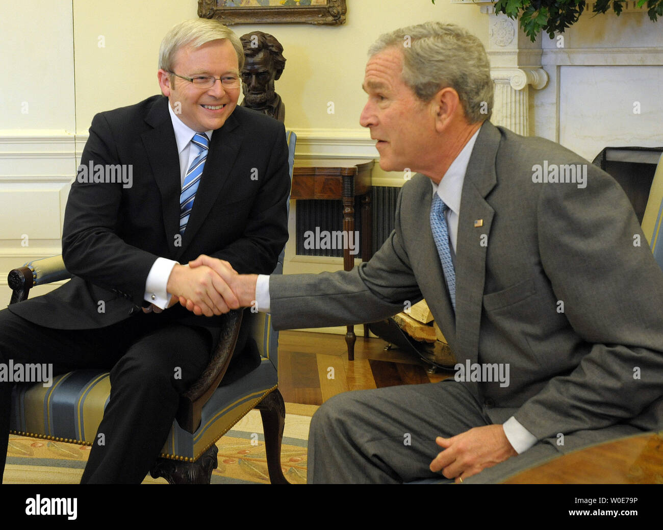 U.S. President George W. Bush shakes hands with Australian Prime ...
