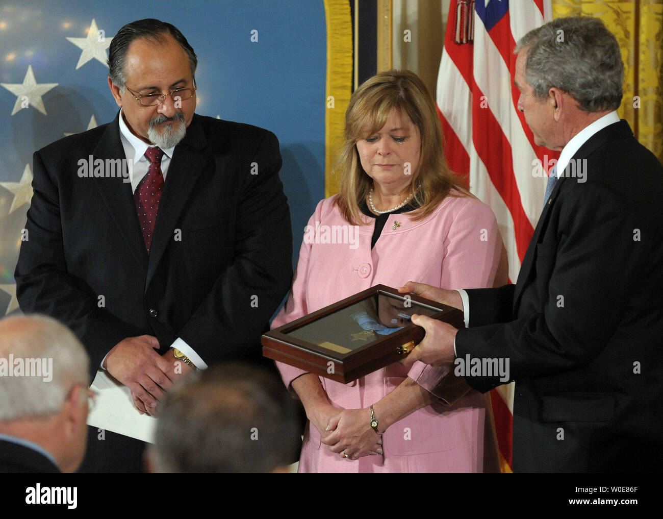 U.S. President George W. Bush gives George and Sally Monsoor, the ...