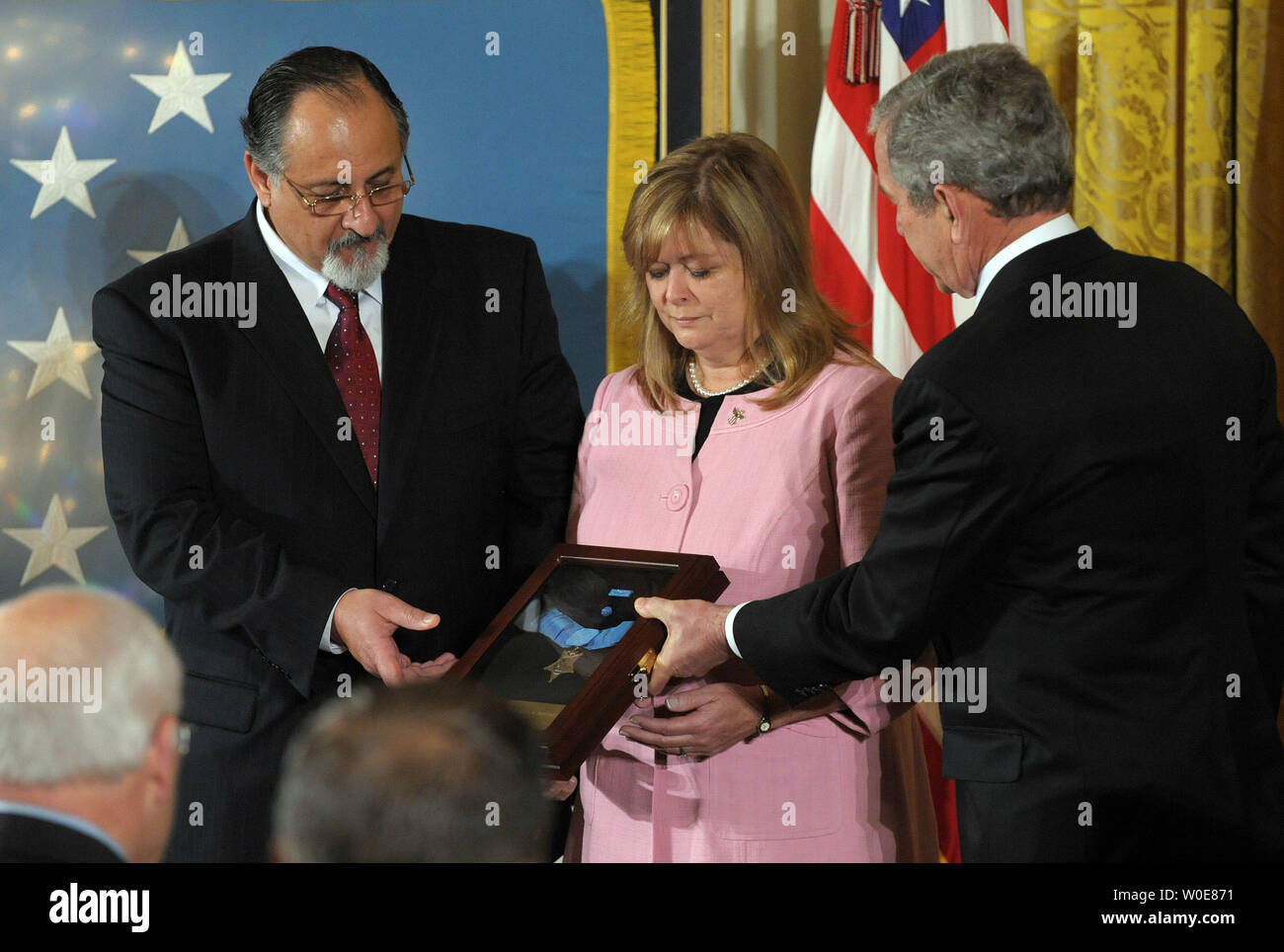 U.S. President George W. Bush gives George and Sally Monsoor, the ...