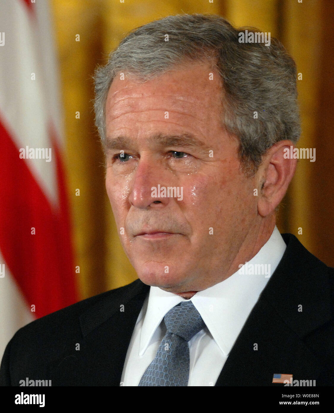 U.S. President George W. Bush cries as he attends a ceremony honoring U ...