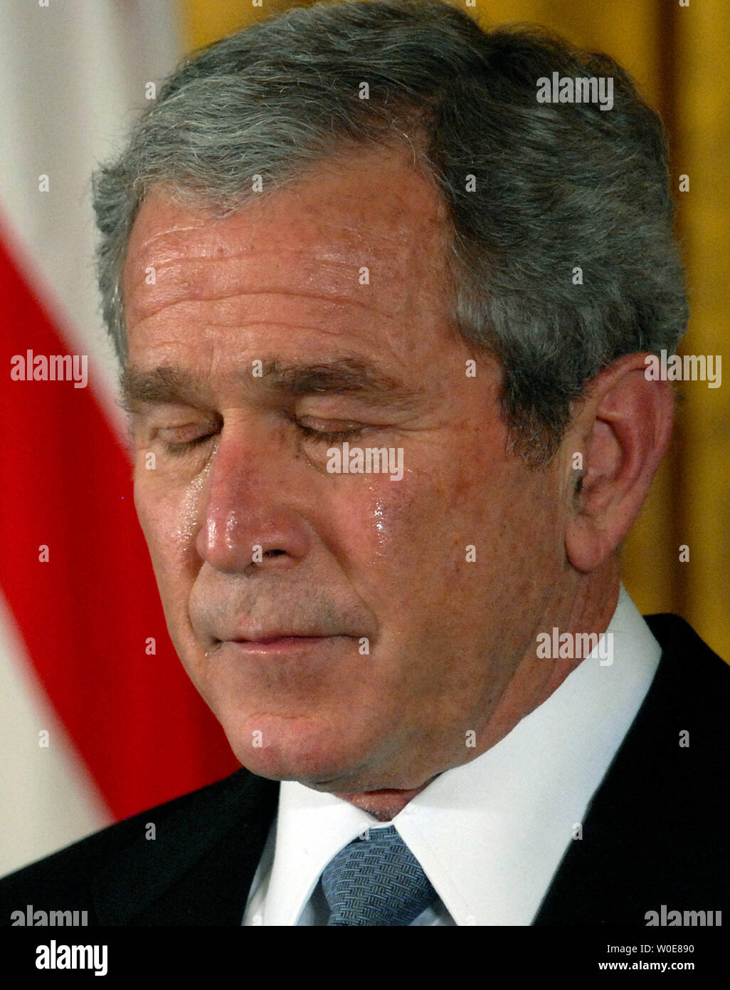 U.S. President George W. Bush cries as he attends a ceremony honoring U ...