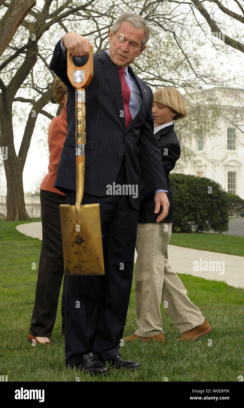U.S. President George W. Bush eyes the ceremonial shovel after a ...