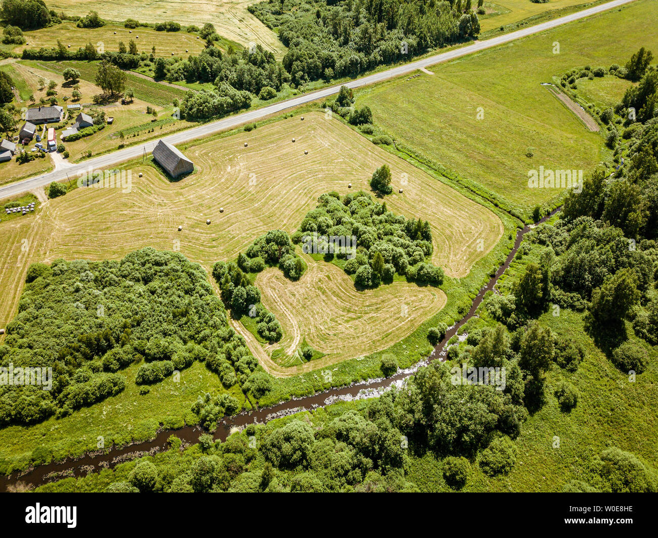 countryside roads and fields with small village. aerial view, drone ...