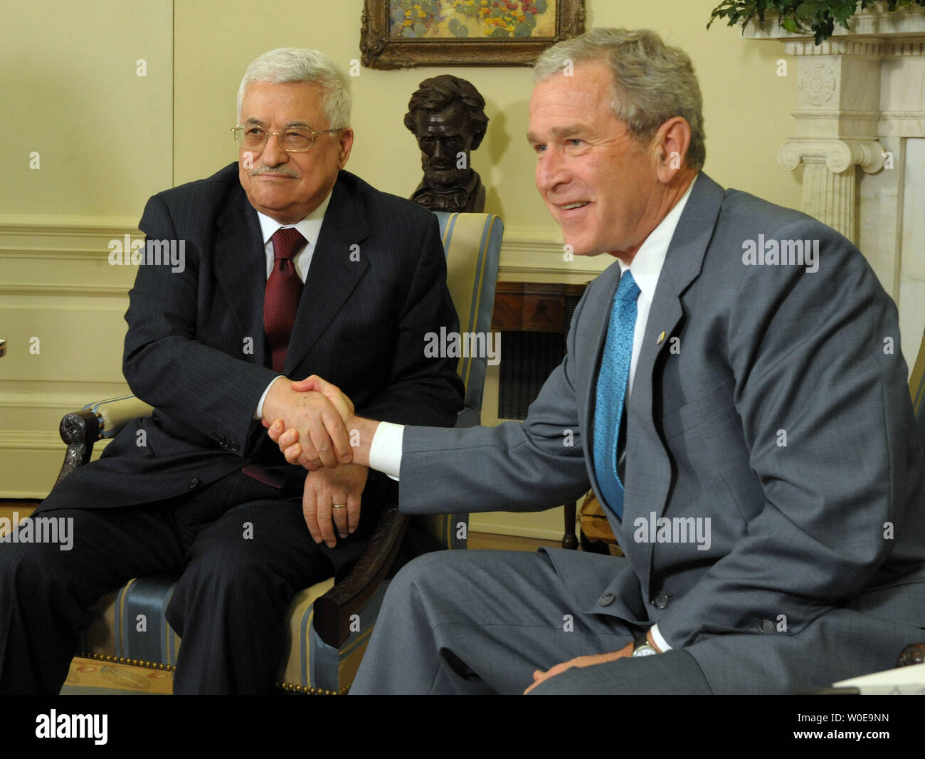 U.S. President George W. Bush (R) shakes hands with Palestinian ...