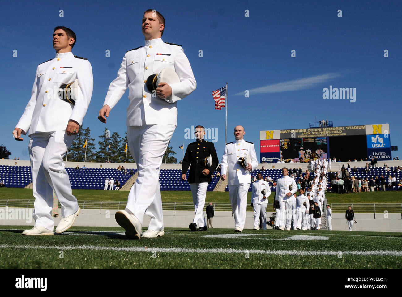 Midshipmen enter Navy-Marine Corps Memorial Stadium during the Class of ...