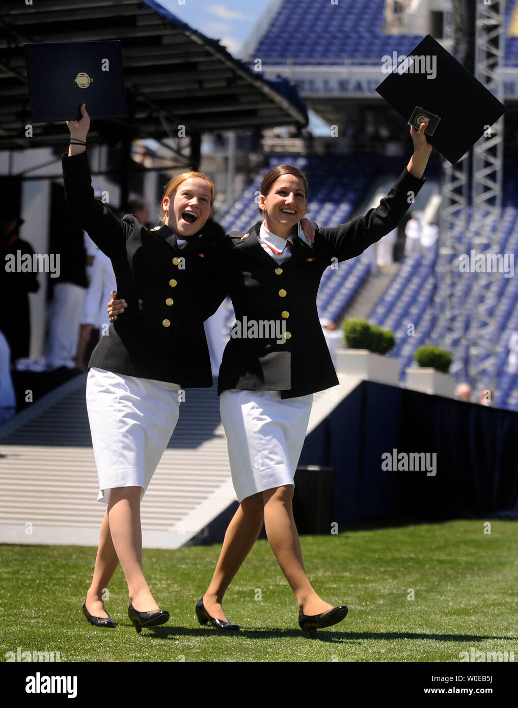 Midshipmen of the Twenty-Second Company celebrate after receiving their ...