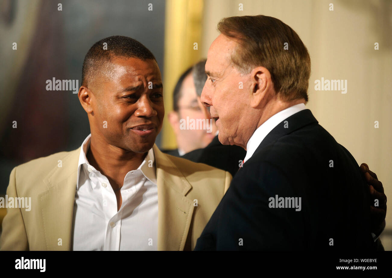 Actor Cuba Gooding Jr. greets retired Sen. Bob Dole (R-KS) as they ...