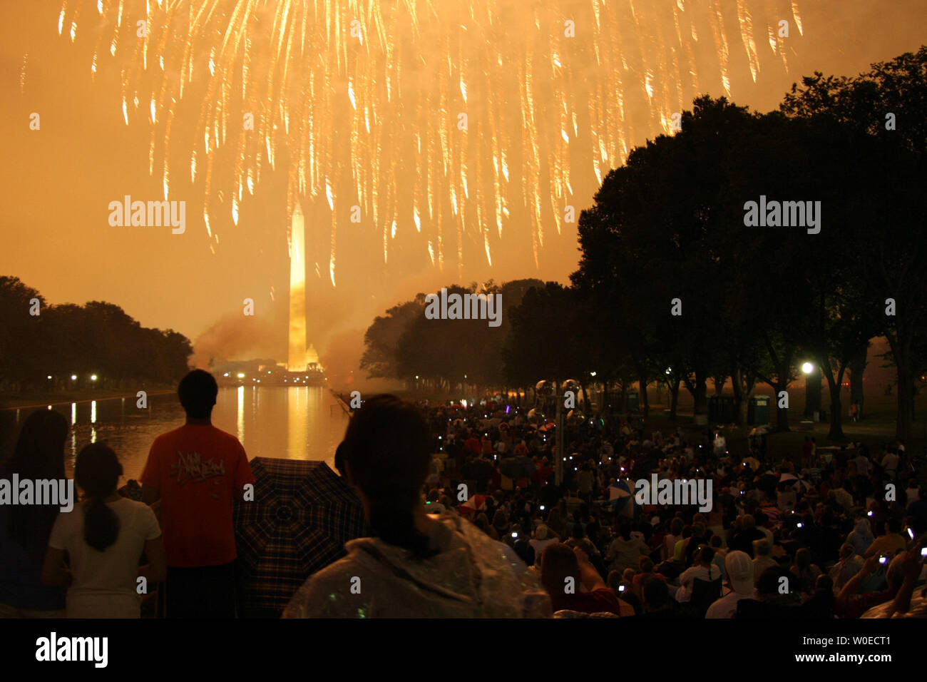 Fireworks explode in the sky above the Washington Monument as the ...